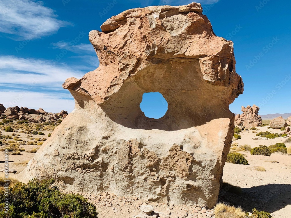 Volcanic rock formation with round hole in desert Atacama, Bolivia ...