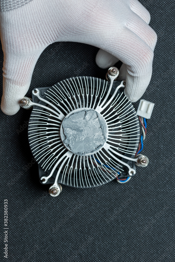 Cpu cooler with old thermal paste. Servicing pc and cleaning old paste ...