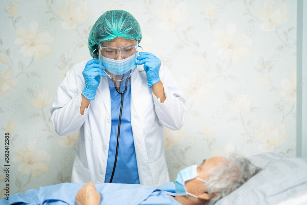Asian doctor wearing face shield and PPE suit new normal to check ...