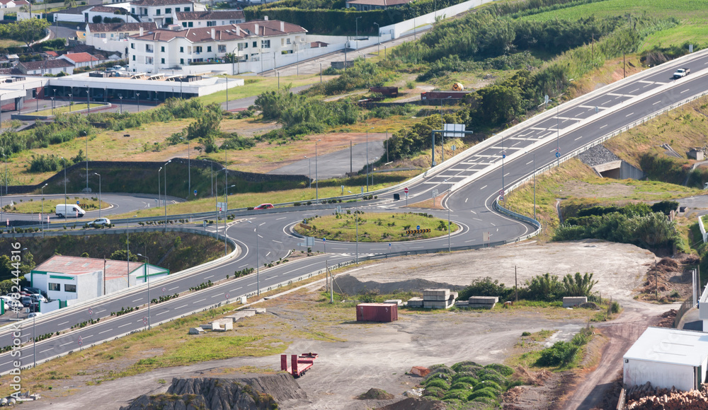 Transport intersection with a roundabout in the middle of the ...