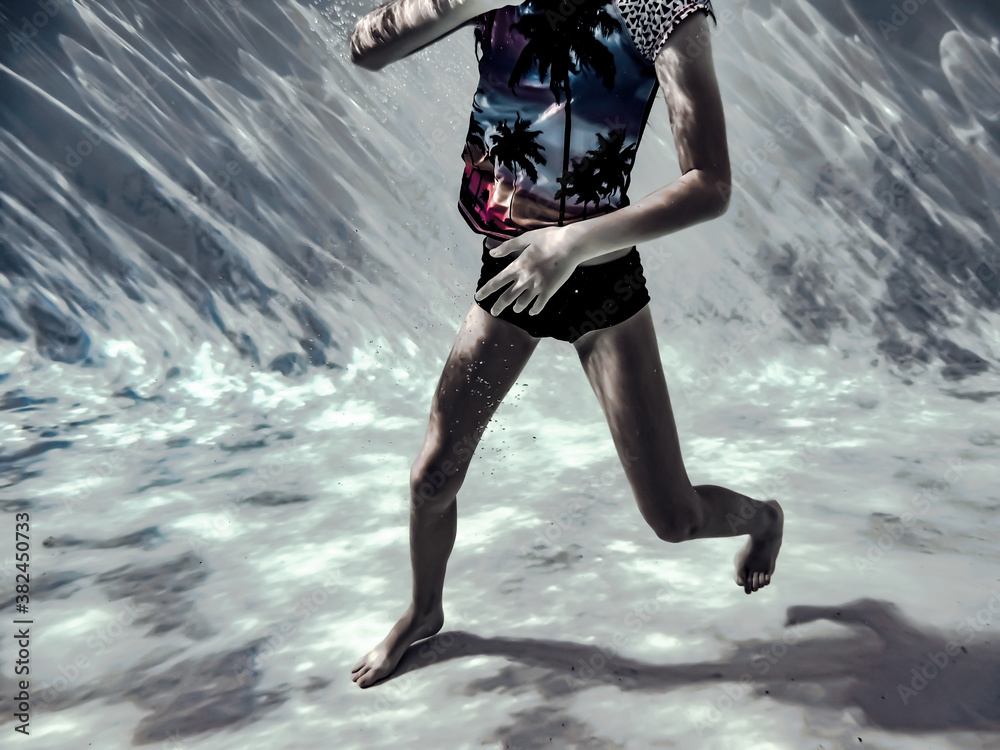 Teenage girl underwater running with light refracting off the sides of ...