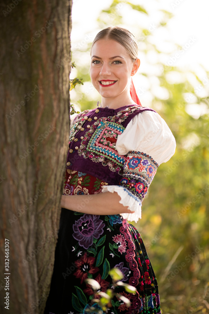 Young beautiful slovak woman in traditional costume. Slovak folklore ...