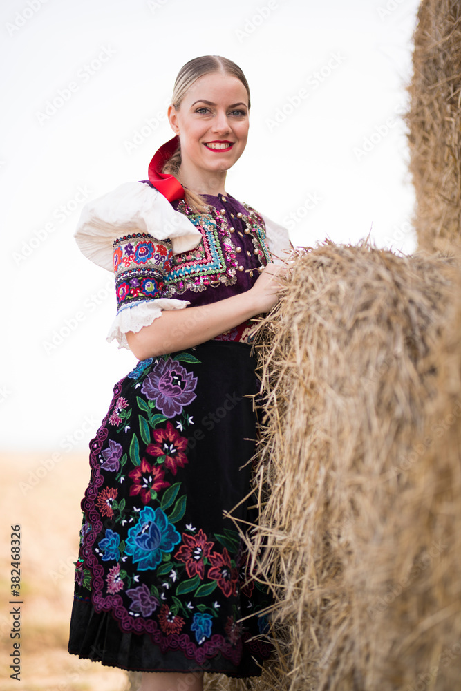Young beautiful slovak woman in traditional costume. Slovak folklore ...