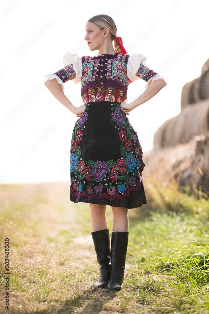 Young beautiful slovak woman in traditional costume. Slovak folklore ...