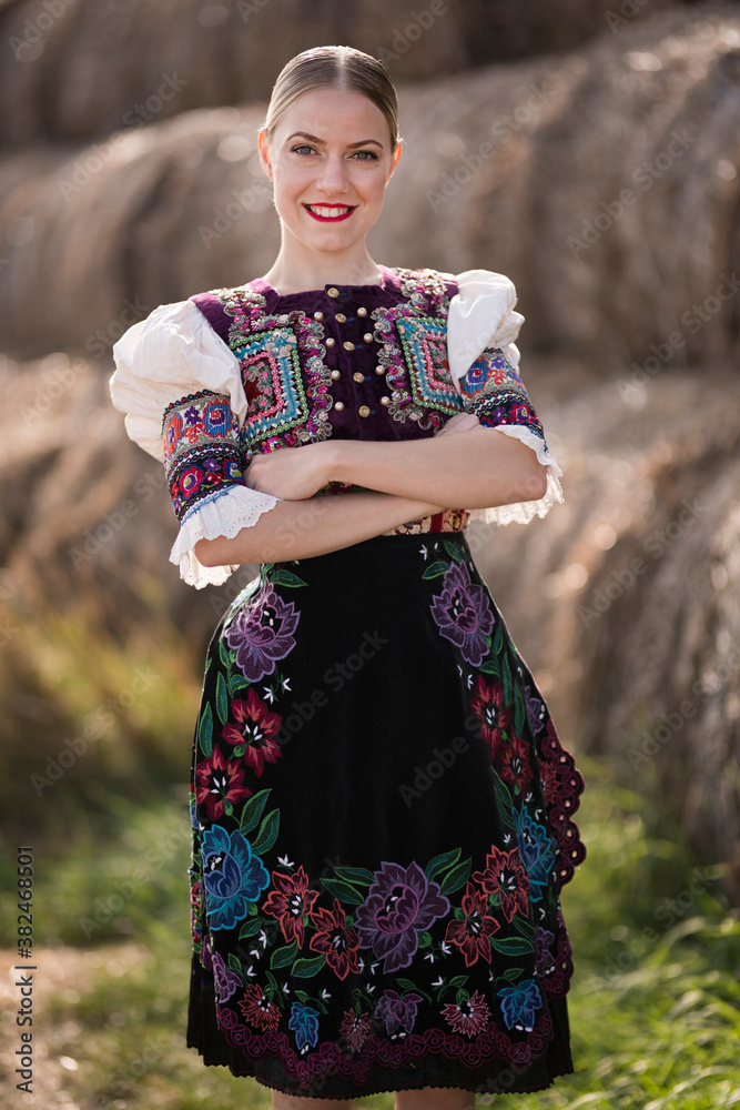 Young beautiful slovak woman in traditional costume. Slovak folklore ...
