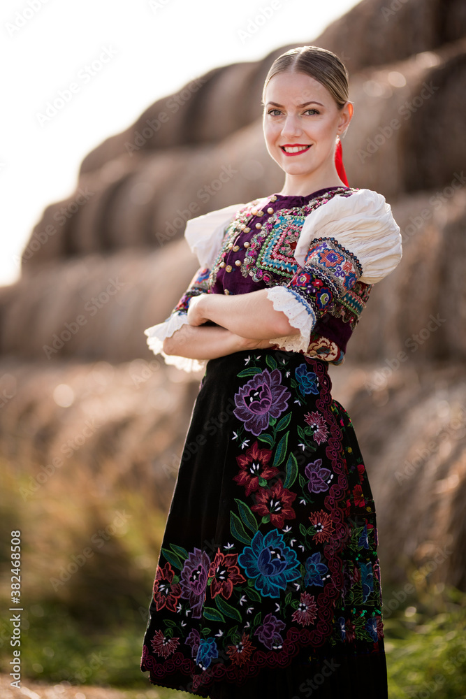 Young beautiful slovak woman in traditional costume. Slovak folklore ...