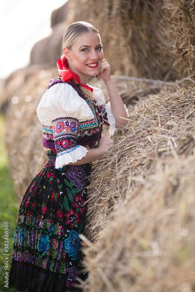 Young beautiful slovak woman in traditional costume. Slovak folklore ...