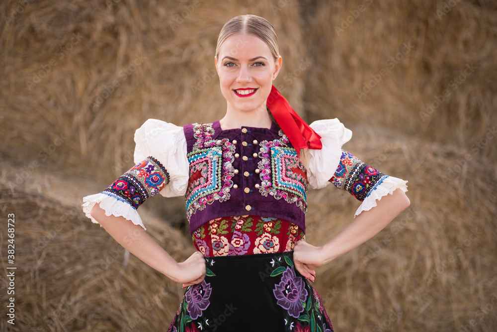 Young beautiful slovak woman in traditional costume. Slovak folklore ...