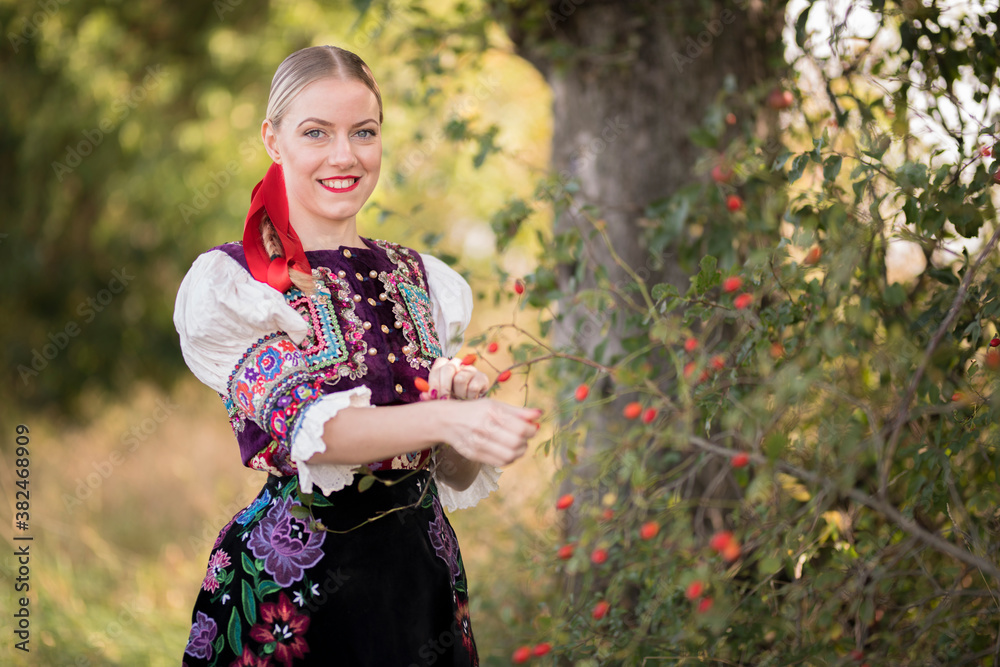 Young beautiful slovak woman in traditional costume. Slovak folklore ...
