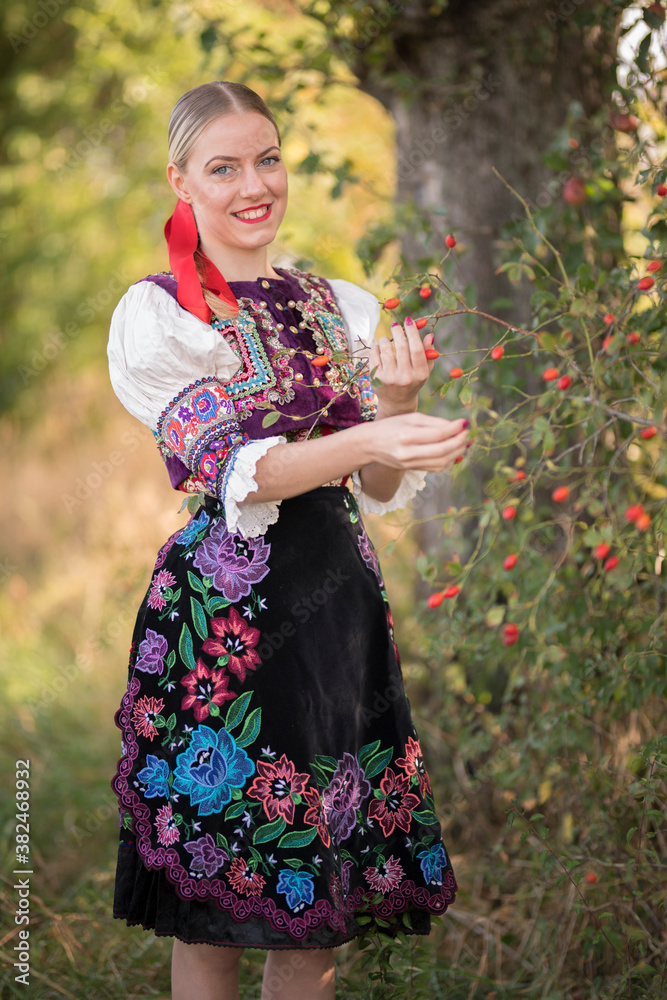 Young beautiful slovak woman in traditional costume. Slovak folklore ...