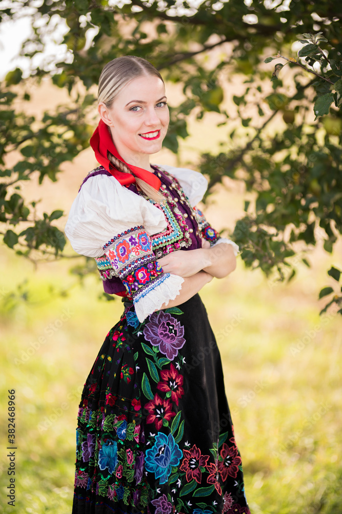 Young beautiful slovak woman in traditional costume. Slovak folklore ...
