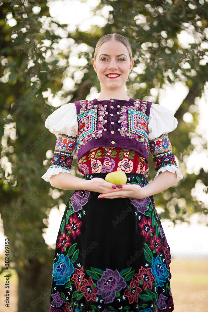 Young beautiful slovak woman in traditional costume. Slovak folklore ...