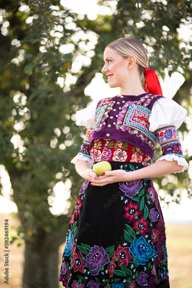 Young beautiful slovak woman in traditional costume. Slovak folklore ...