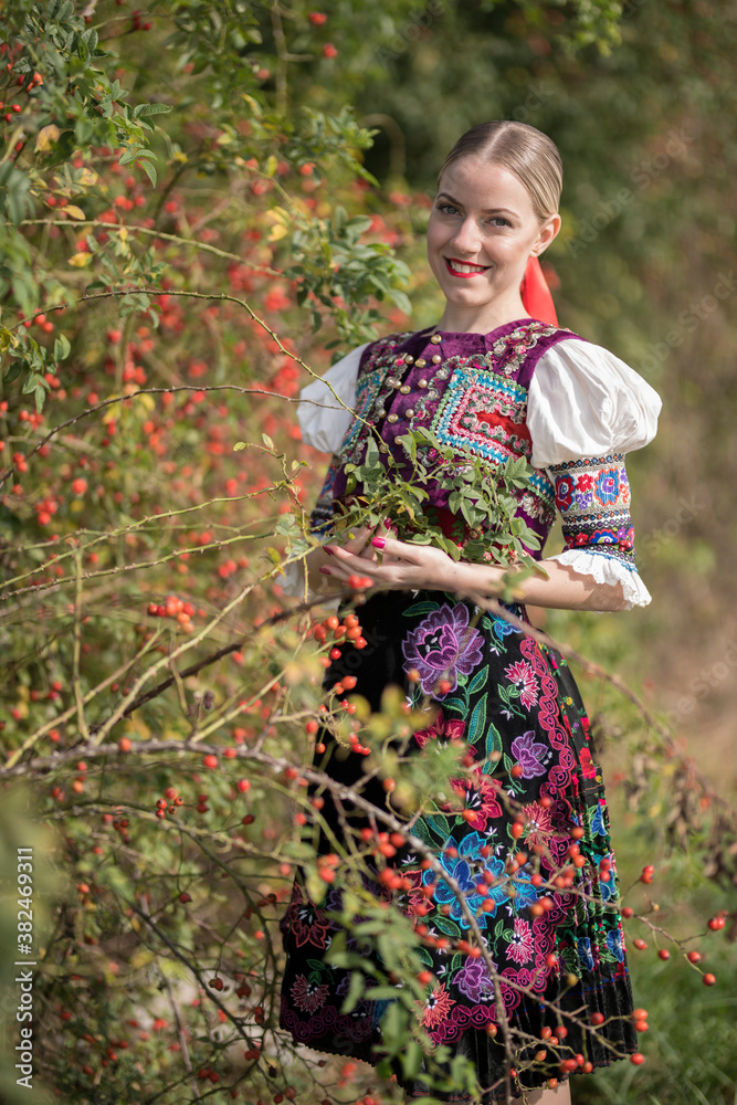 Young beautiful slovak woman in traditional costume. Slovak folklore ...