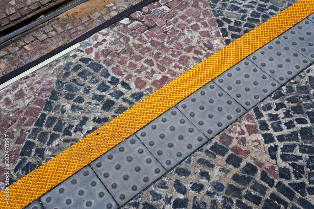 Warning bumps for blind people at the sidewalk Stock Photo | Adobe Stock