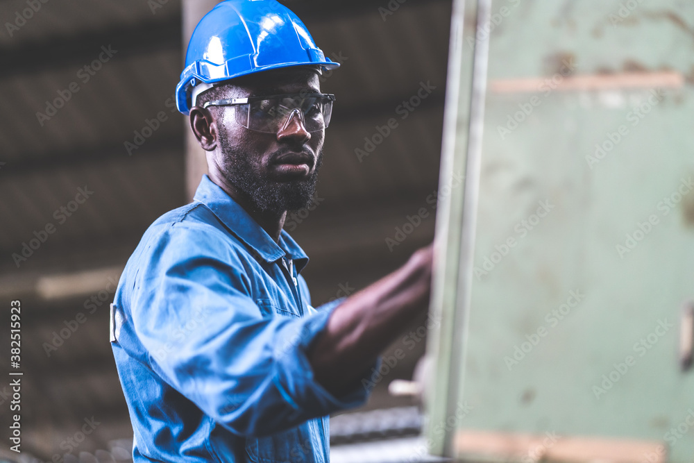 Black Male Engineer Working on machine in Factory. black man engineer ...
