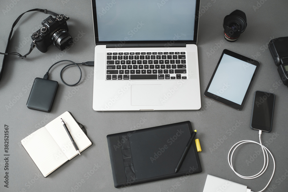 Laptop And Photography Gear On The Grey Background Stock Photo | Adobe ...