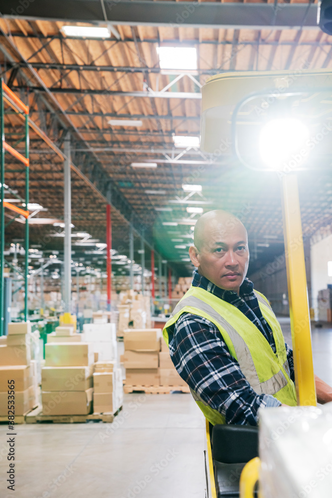 Forklift in a warehouse Stock Photo | Adobe Stock