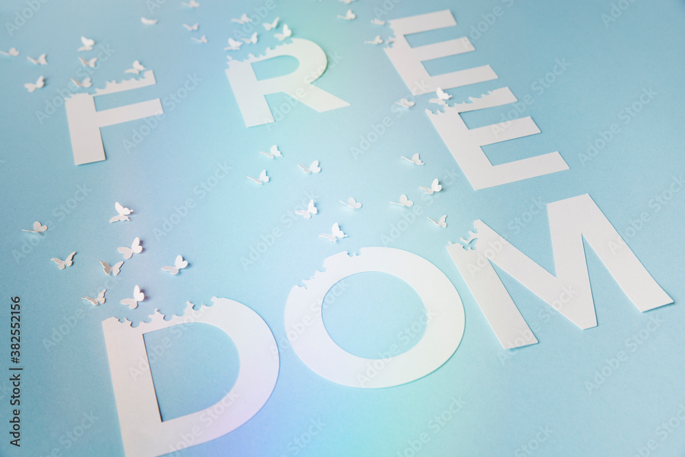 Freedom message with white cardboard butterflies Stock Photo | Adobe Stock