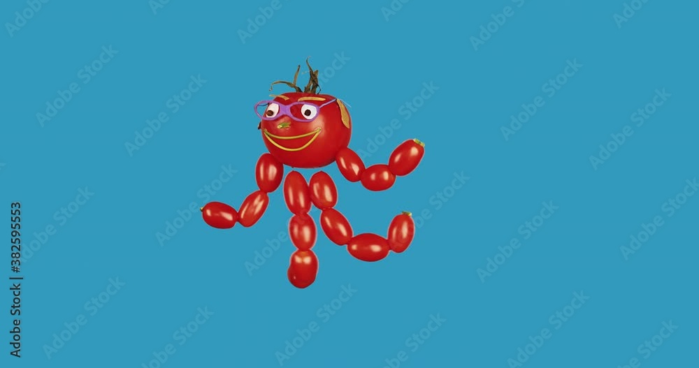 Red man tomato in glasses is dancing on a blue background. Live ...