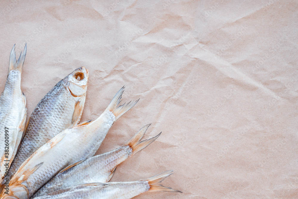 Dried fishes flat lay template banner on craft paper background with ...
