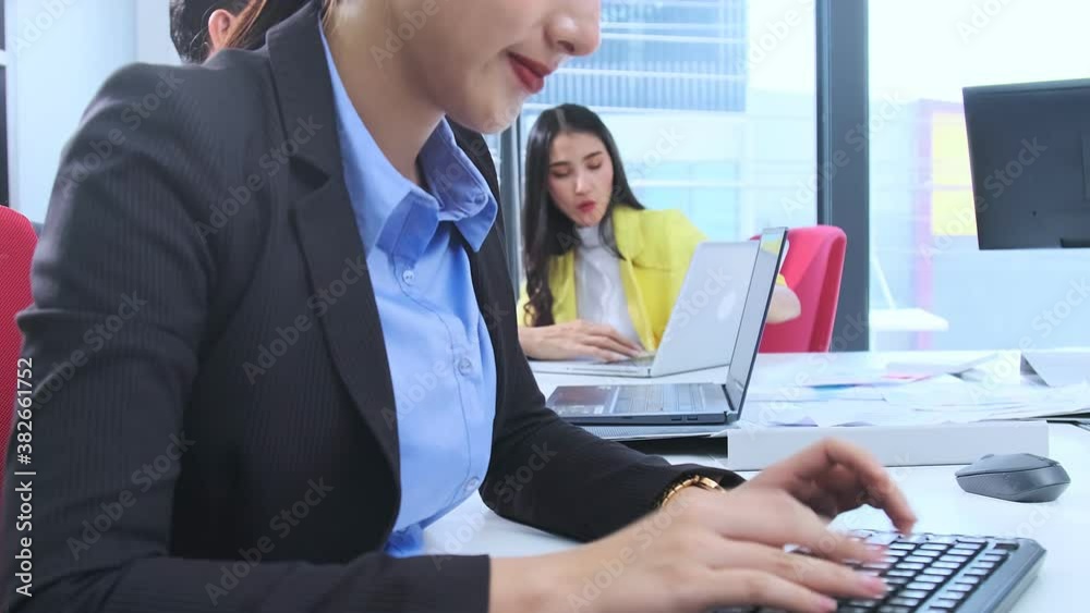 Asian employee officer attractive positive smile woman working on ...