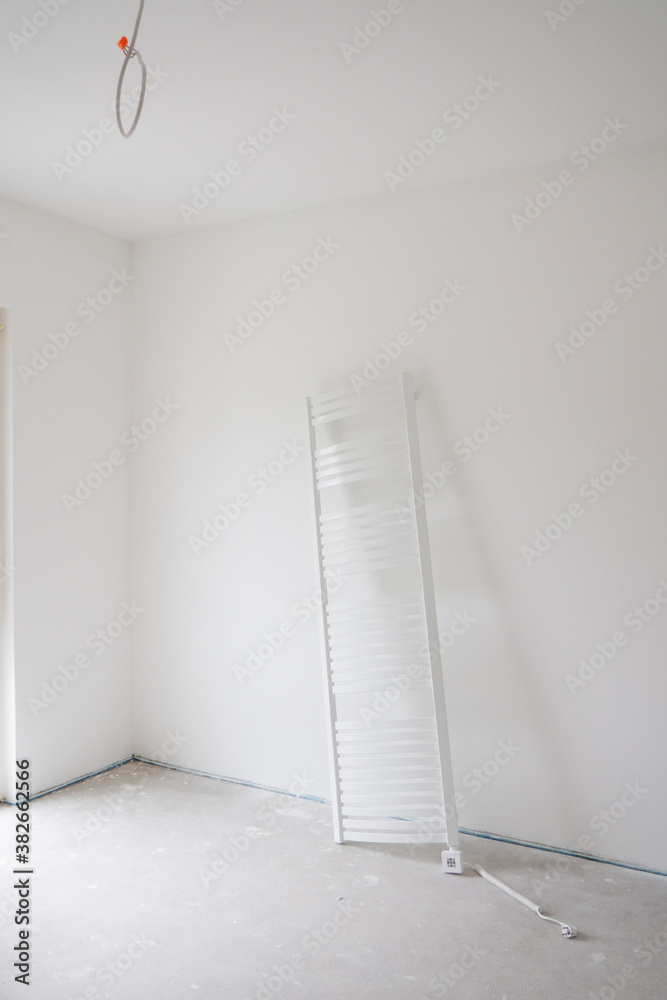 Vertical shot of empty white room in house during renovation ...