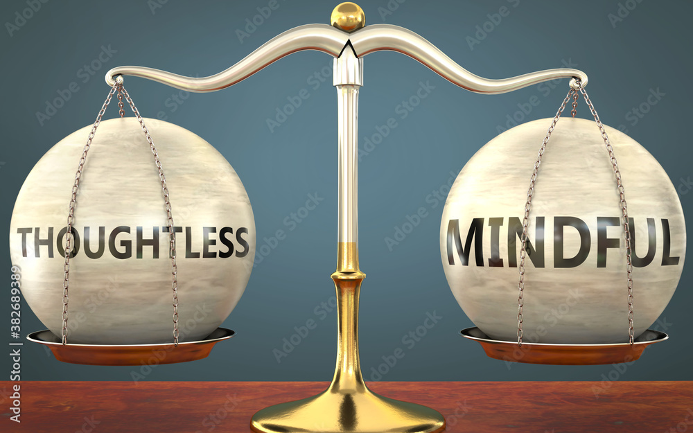thoughtless and mindful staying in balance - pictured as a metal scale ...