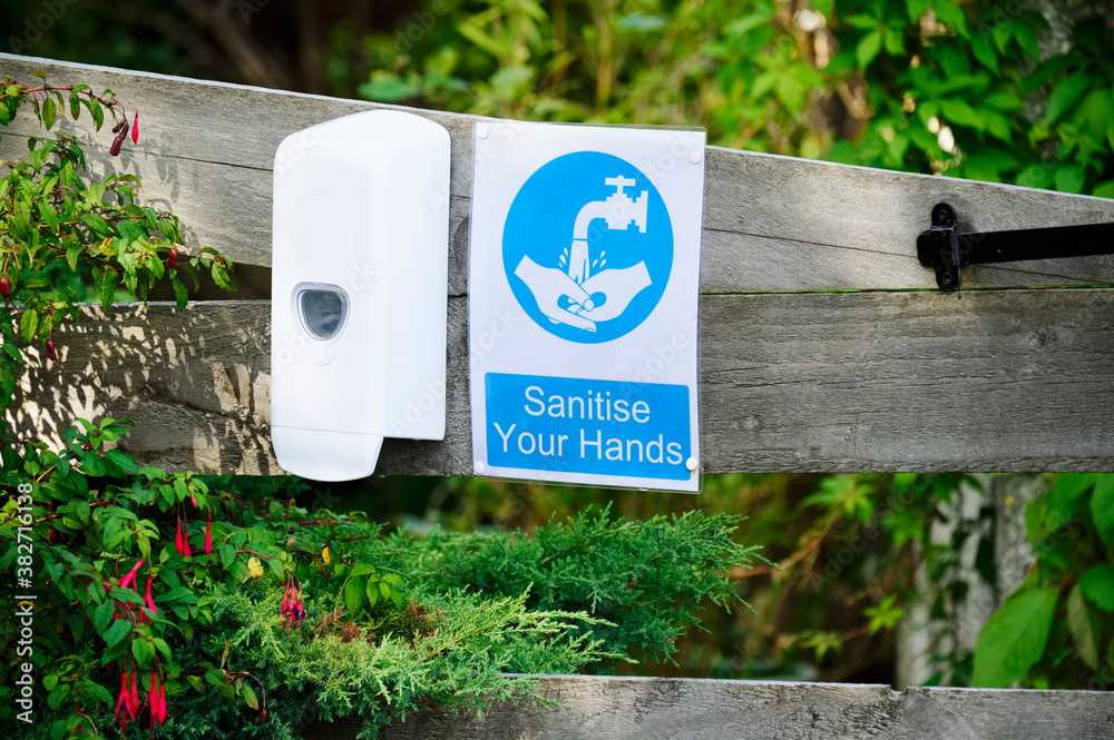 Hand sanitiser dispenser for customer use to wash hands reduce risk of ...