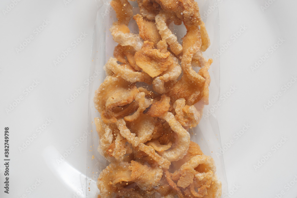 pork snack, pork rind, pork scratching without fat caps in plastic bag ...