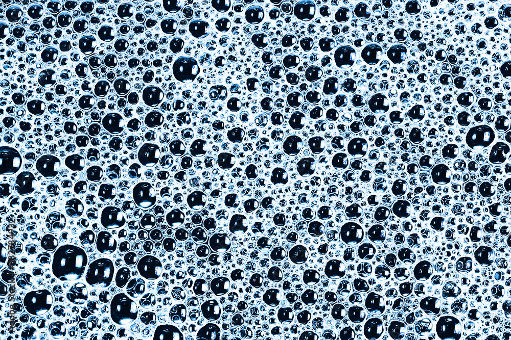 Water foam texture. White foam structure. Blue bubble background ...