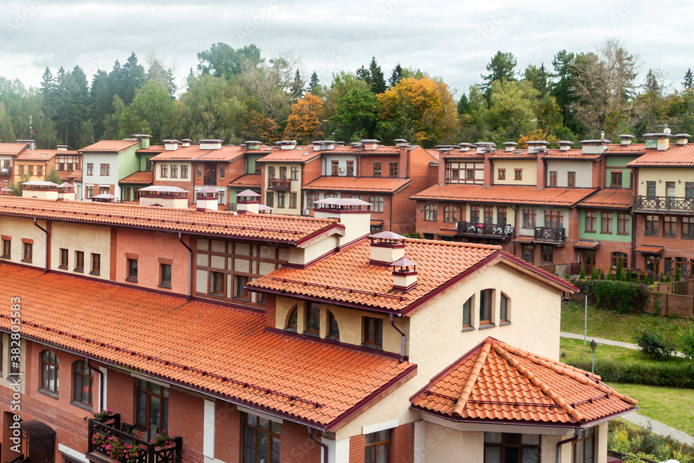 Town architecture of the brown roof townhouse with windows autumn ...