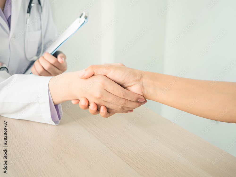 female doctor shacking patient hand after giving advice or doing health ...