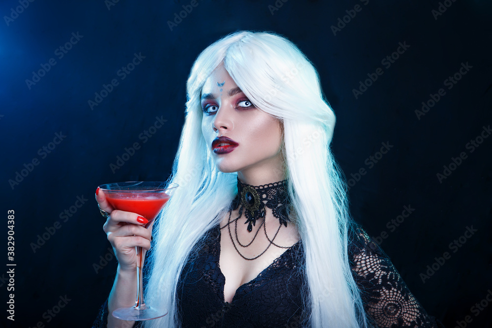 Vampire Halloween sexy woman with long white hair drinking blood Stock ...