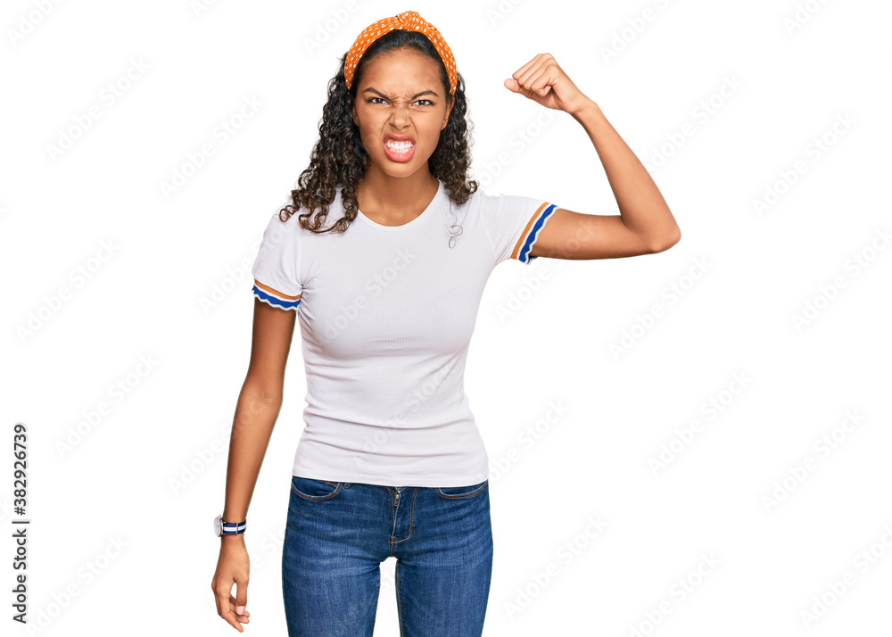 Young african american girl wearing casual clothes angry and mad ...