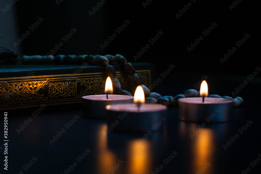 Quran in the mosque - open for prayers The black background of the ...