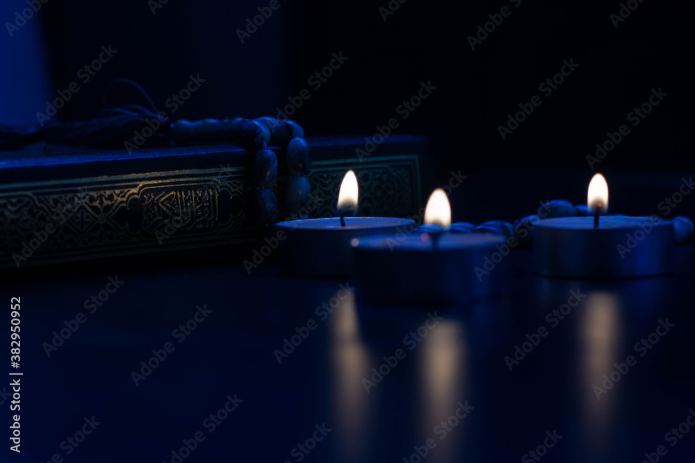 Quran in the mosque - open for prayers The black background of the ...