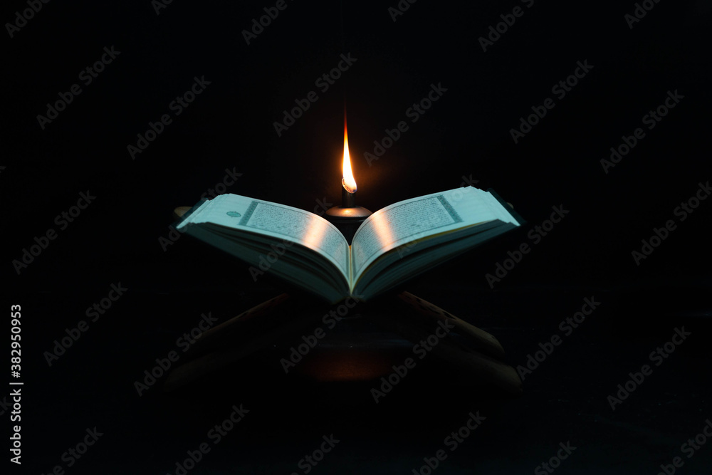Quran in the mosque - open for prayers The black background of the ...