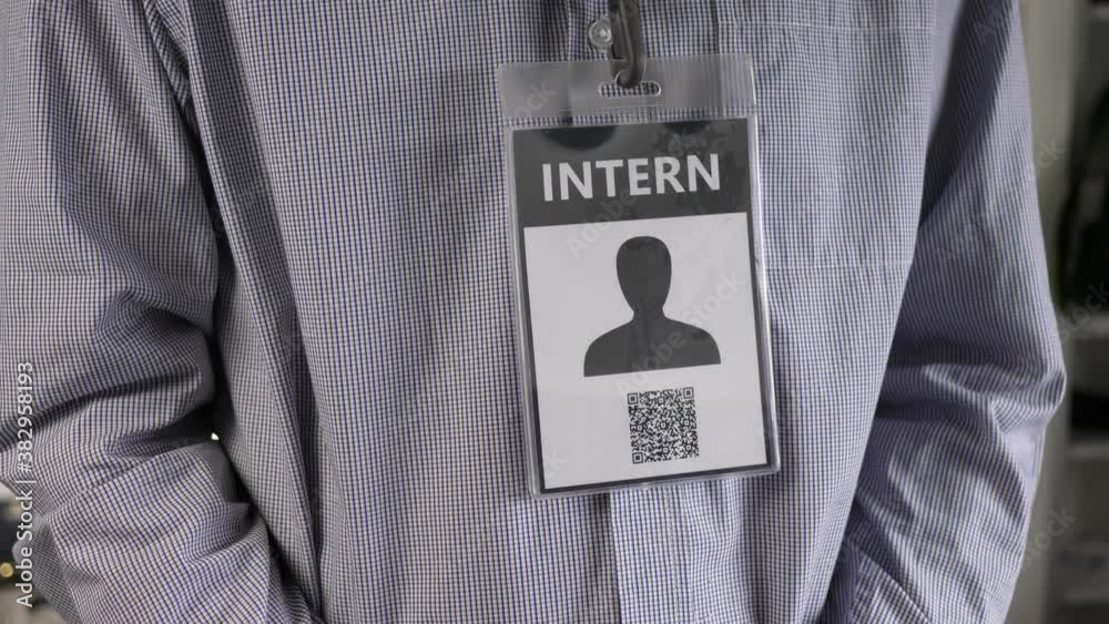 Intern wearing his ID badge around his neck to identify himself. 素材庫影片 ...