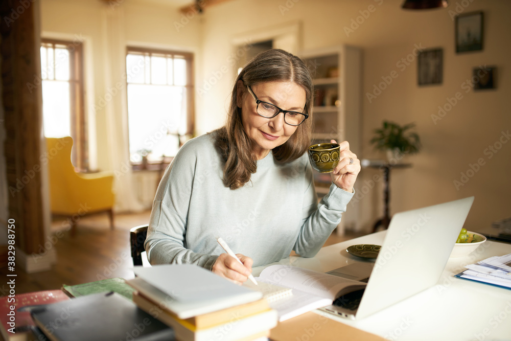 People, aging, retirement and occupation concept. Attractive sixty year ...