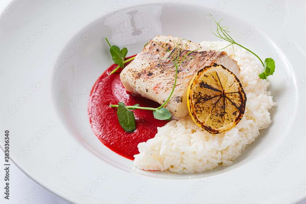Fish with rice and sauce Stock Photo | Adobe Stock