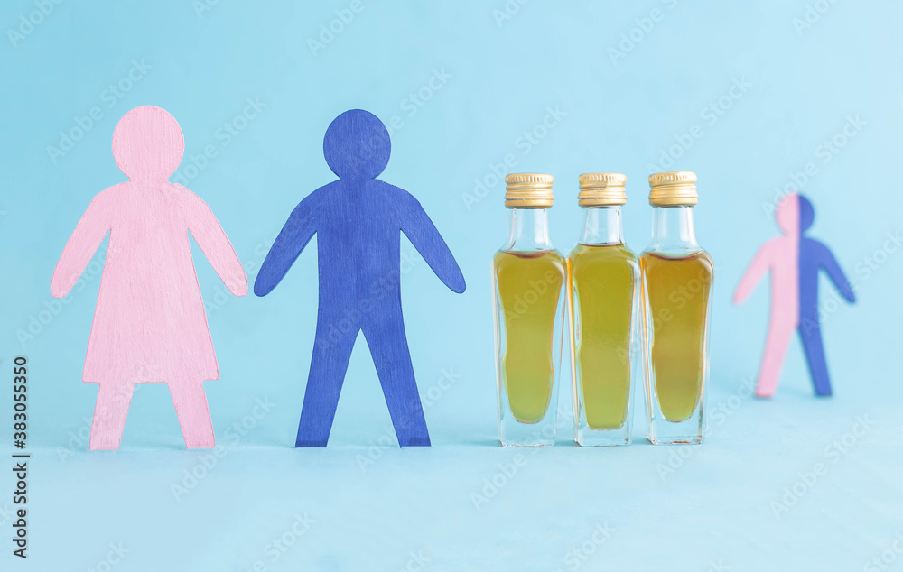 Figurines from a family tree on a blue background and bottles of ...