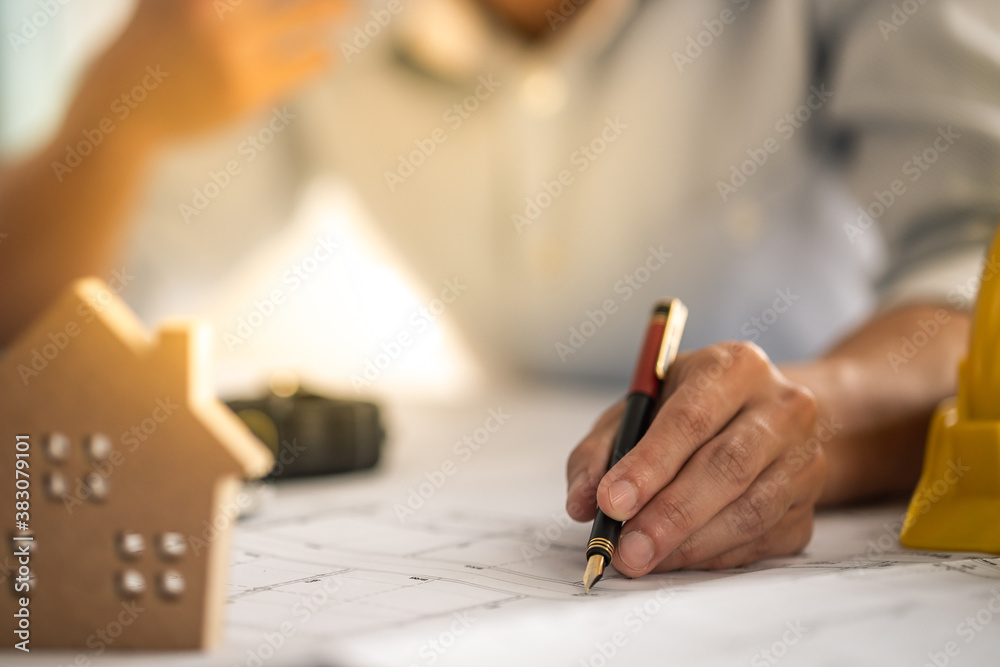 Civil engineer working design construction drawing ; pic is thin DOF ...