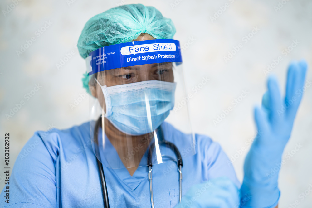 Asian doctor wearing face shield and PPE suit new normal to check ...