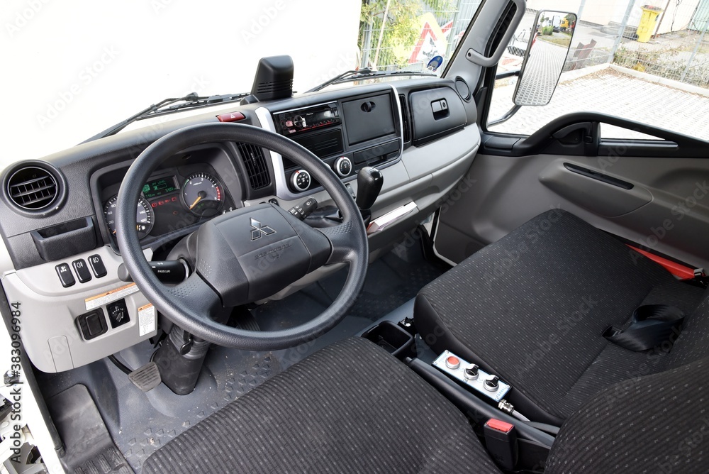 Mitsubishi Fuso. A small truck with a container. Cabin interior ...