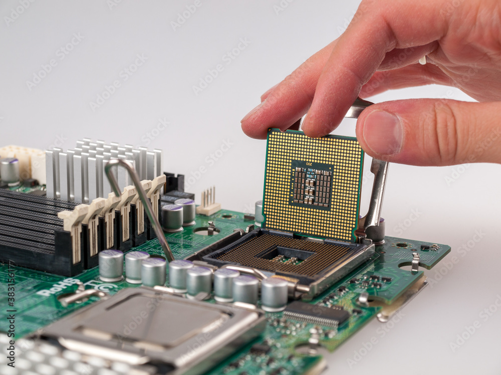 the process of connecting the CPU to the processor socket on a modern computer motherboard ...