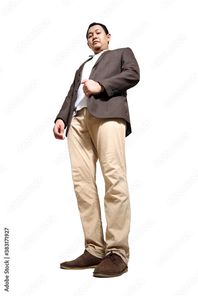 Male Asian businessman standing and looking down, low angle, full ...