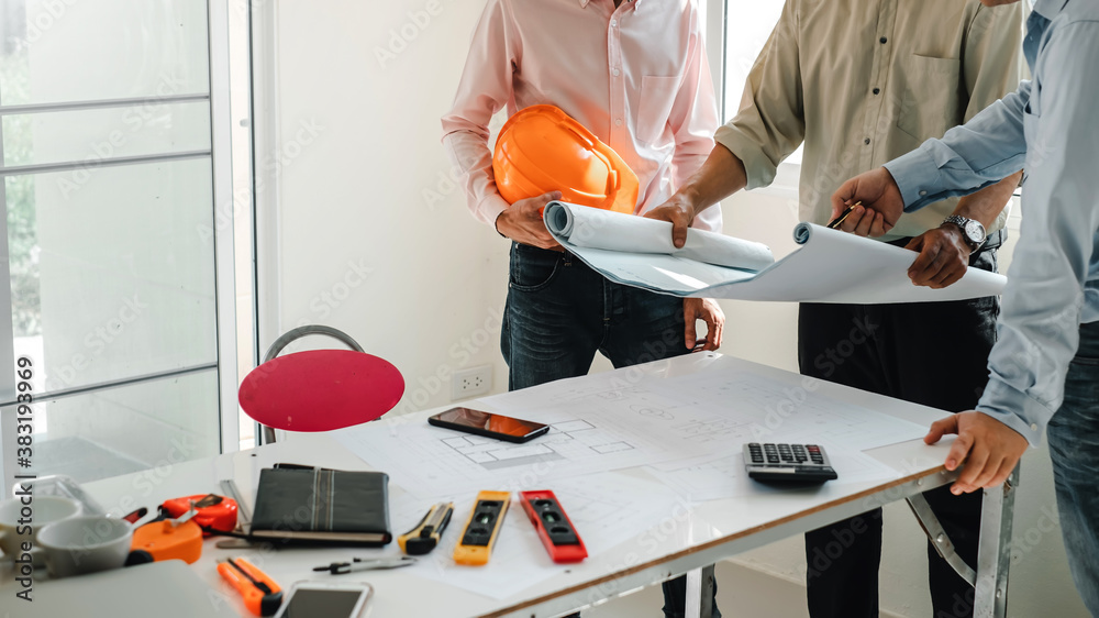 Team of architects and engineers to design and draft a construction ...