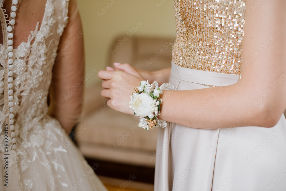 Preparation of bride with bridesmaid in wedding day closeup Stock Photo ...