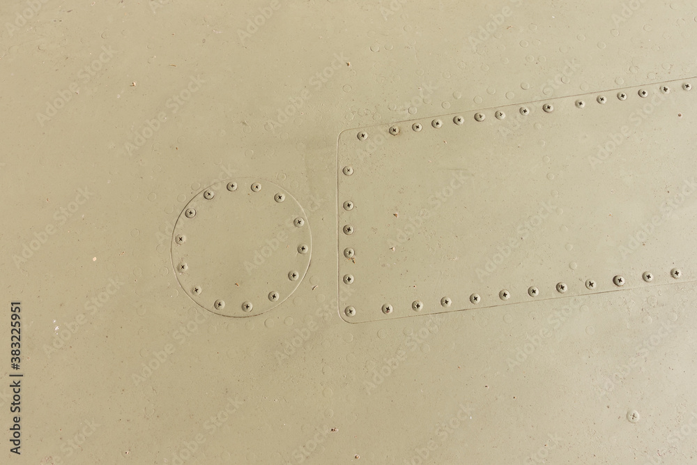 Details of the fuselage of an old aircraft. Camouflage surface with ...